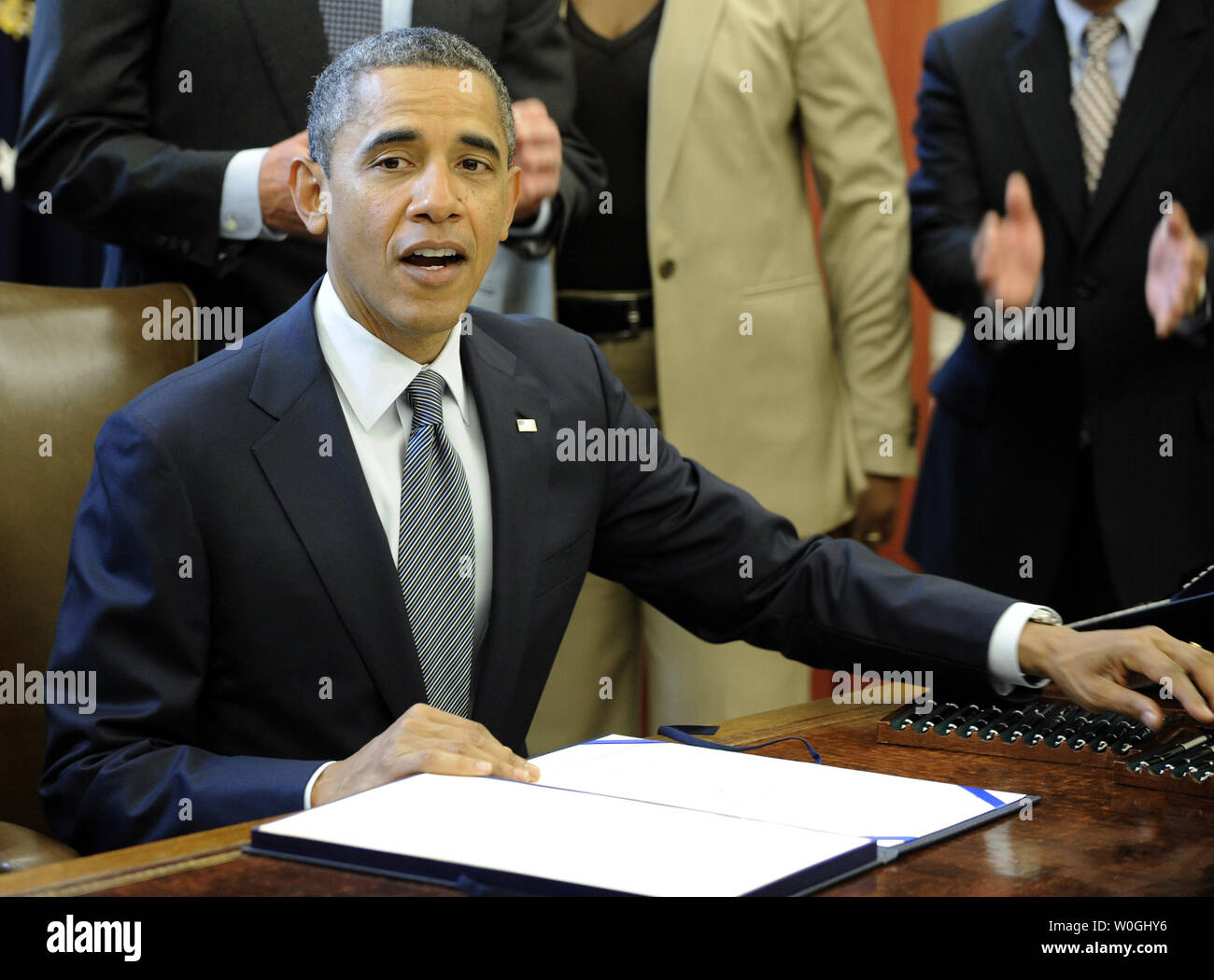 U.S. President Barack Obama signs the Korea Free Trade Agreement in the ...