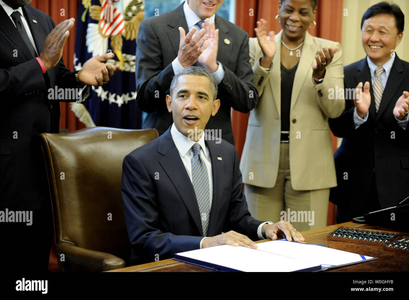 U.S. President Barack Obama signs the Korea Free Trade Agreement in the ...