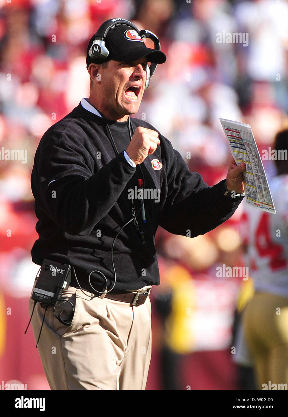 San Francisco 49ers head coach Jim Harbaugh celebrates after full back ...