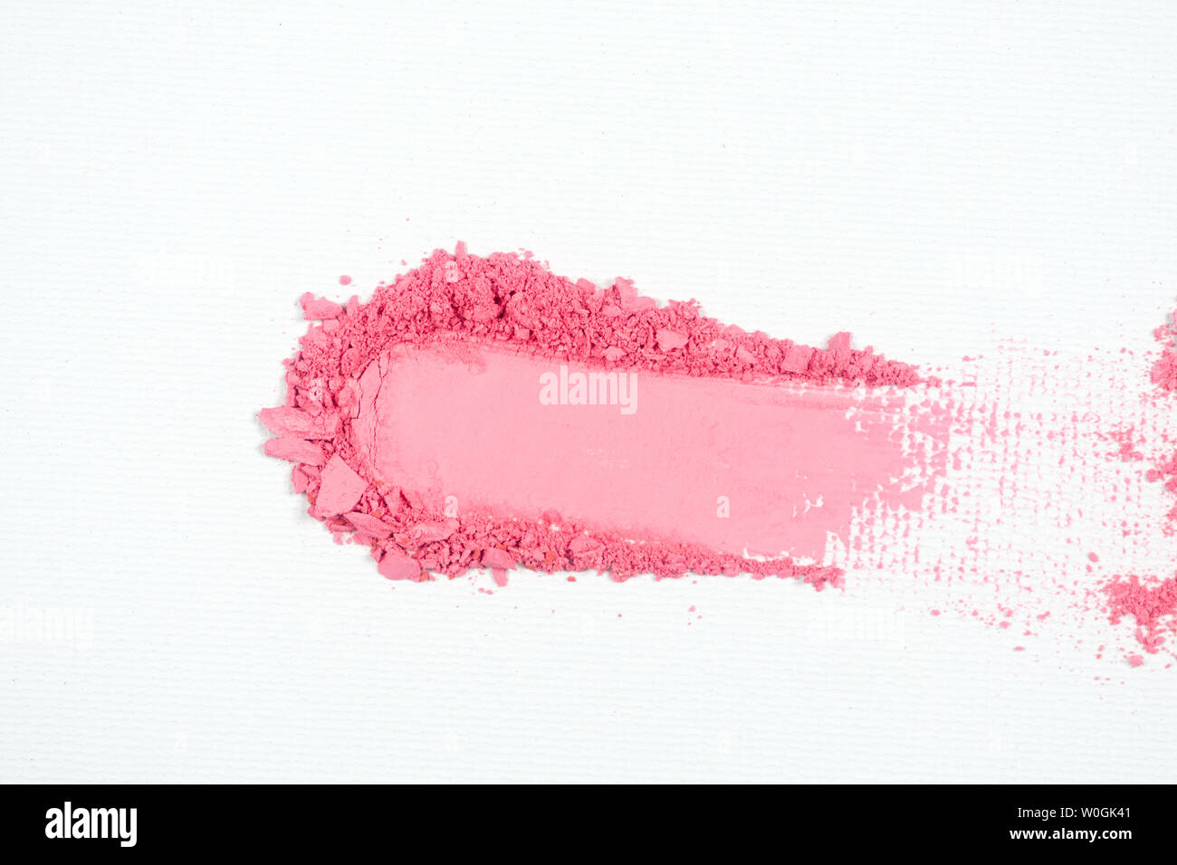 Eye shadow or bronzer pink smudge on white background Stock Photo - Alamy