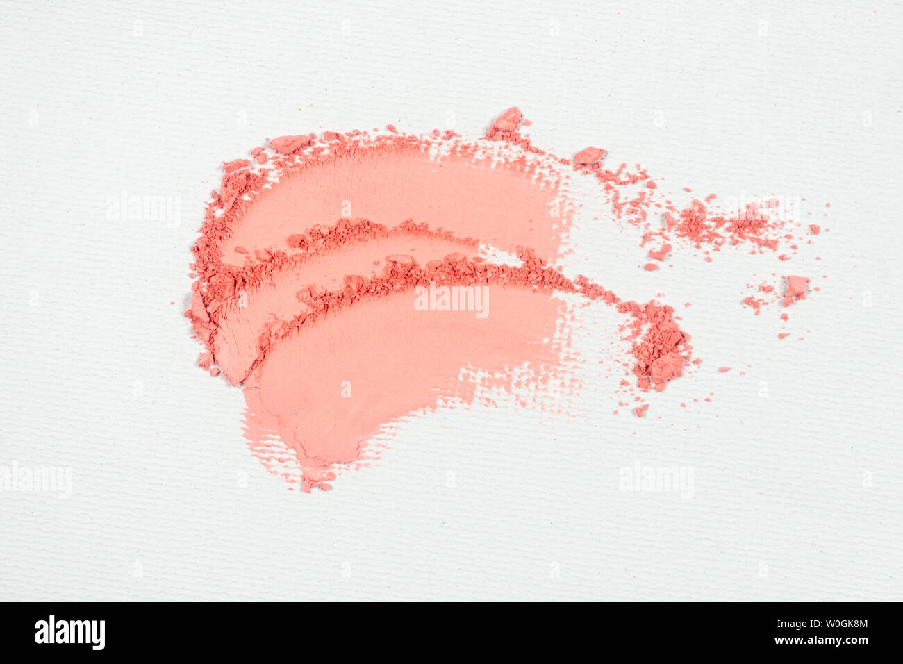 Eye shadow or bronzer pink smudge on white background Stock Photo - Alamy