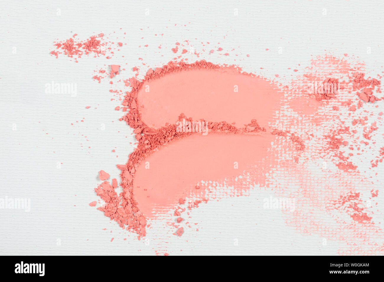 Eye shadow or bronzer pink smudge on white background Stock Photo - Alamy