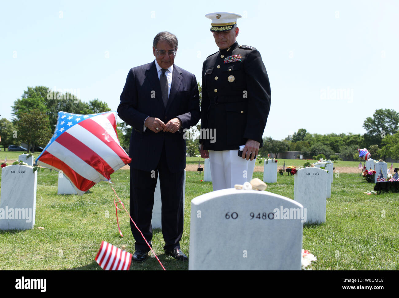 Secretary of Defense Leon Panetta pays his respects to fallen soldiers ...
