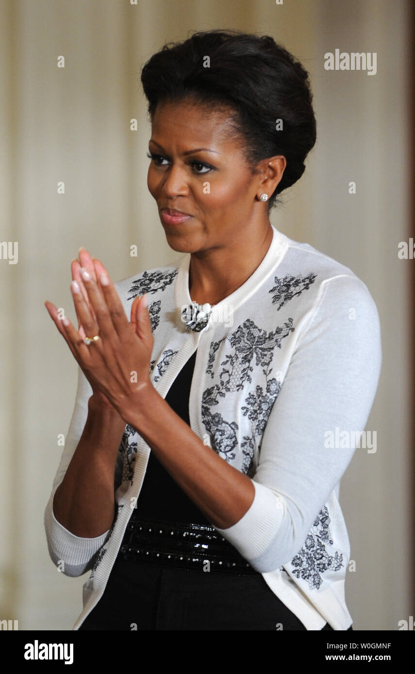 First Lady Michelle Obama beams on her birthday as she listens to U.S ...