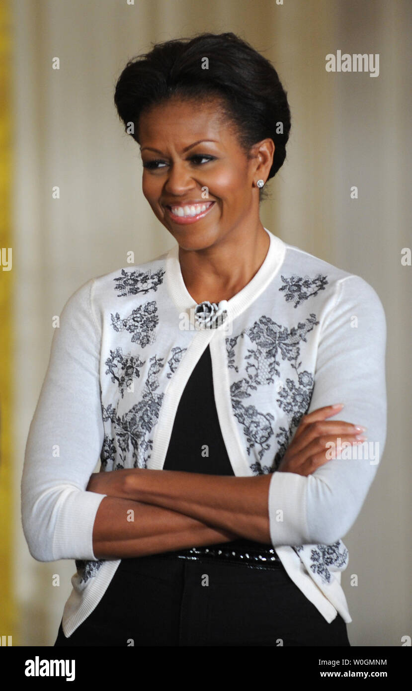First Lady Michelle Obama beams on her birthday as she listens to U.S ...