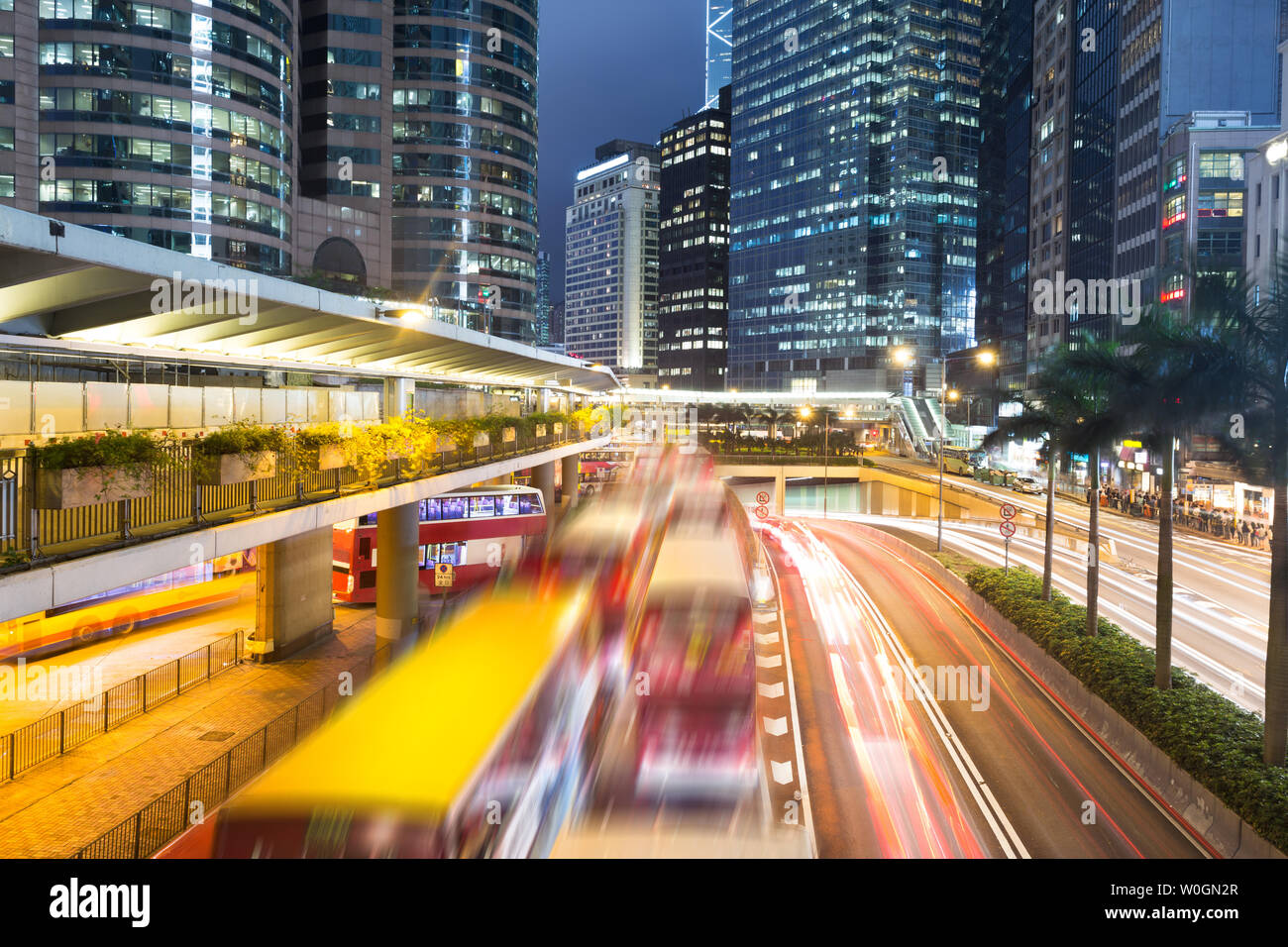 modern urban city traffic trails with cityscape background Stock Photo ...