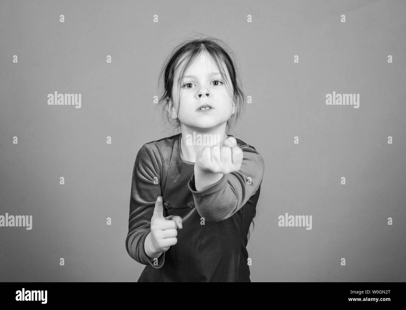 Do not even touch me. Aggressive face small girl violet background ...