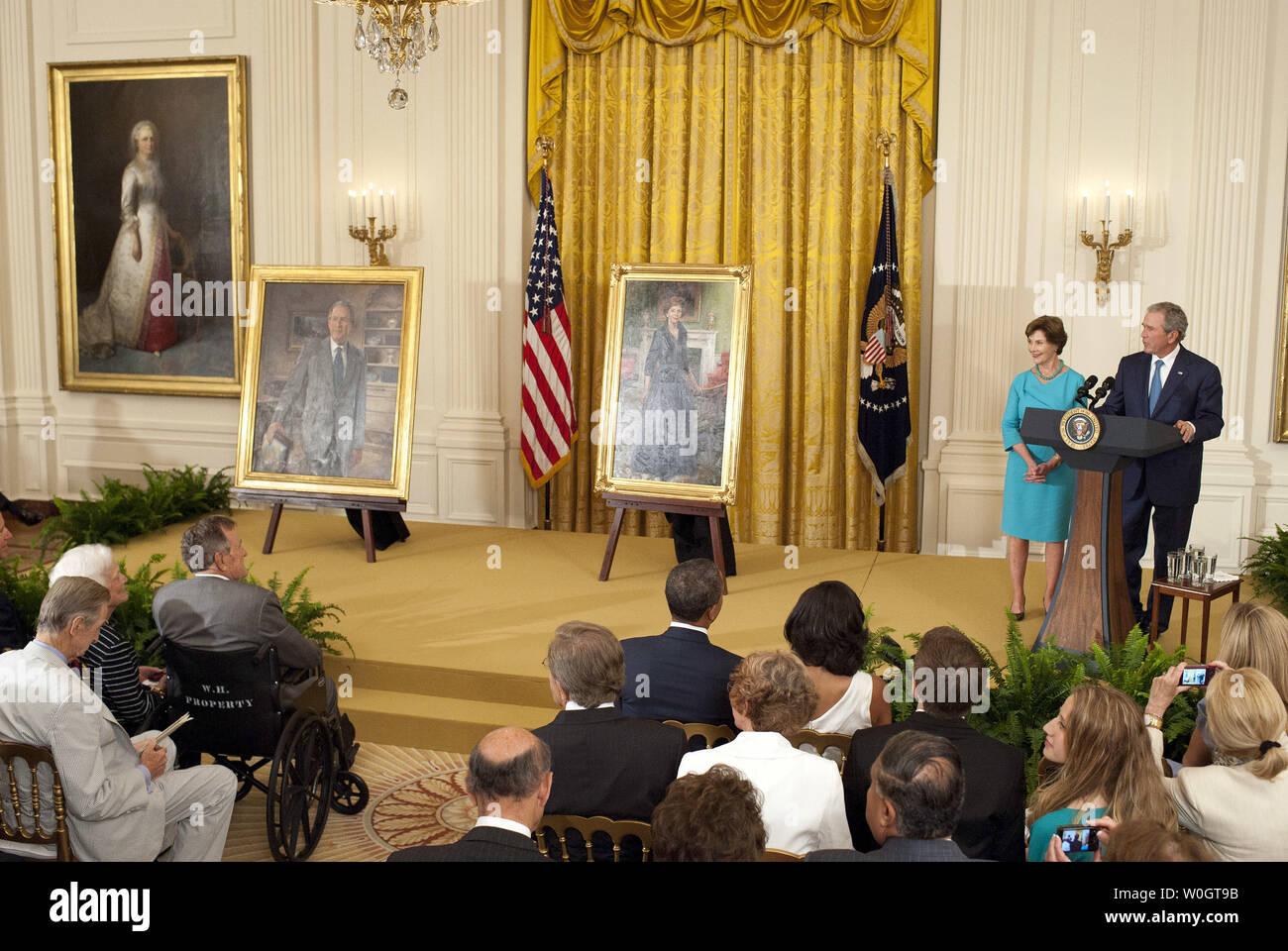 Former President George W. Bush and his wife Laura deliver remarks at ...