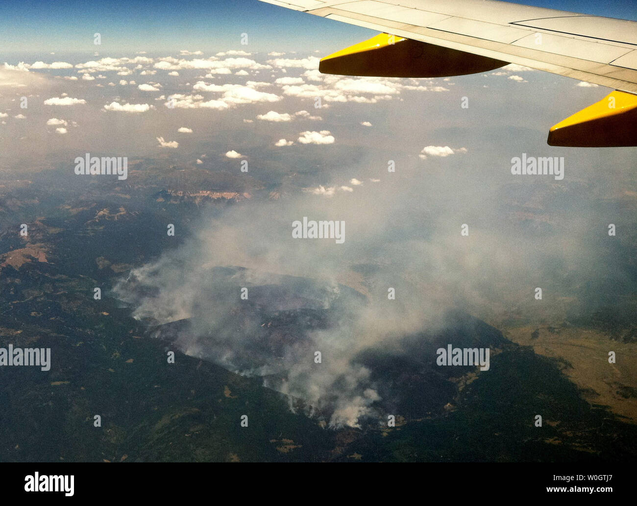 Colorado wildfires are seen from the window of a plane traveling 40,000 ...