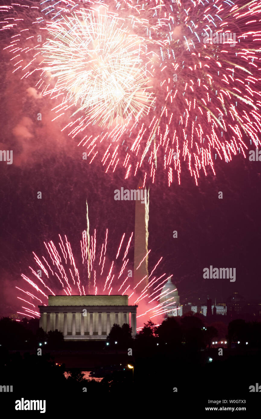 Fireworks explode over the National Mall during the annual Independence ...
