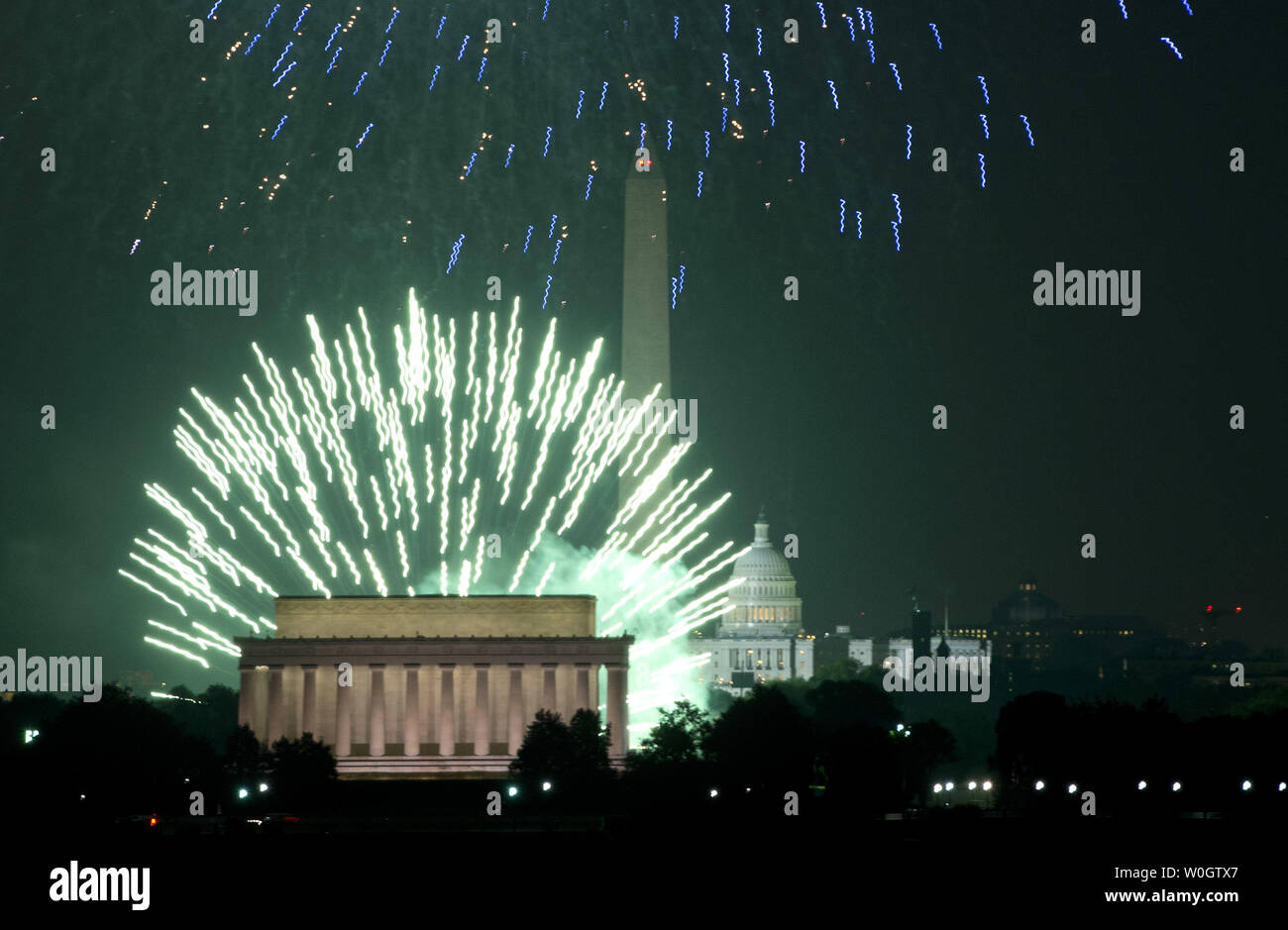 Fireworks explode over the National Mall during the annual Independence ...