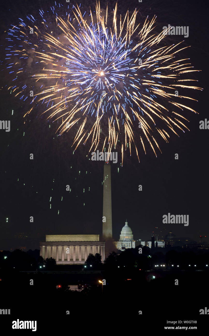 Fireworks explode over the National Mall during the annual Independence ...