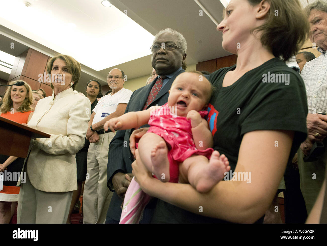 Amarantha Dimyan, held by her mother Jane Dimyan-Ehrenfeld, cries as ...