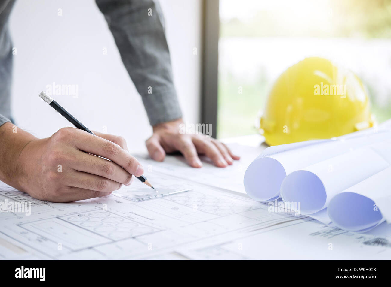 Construction engineering or architect hands working on blueprint ...