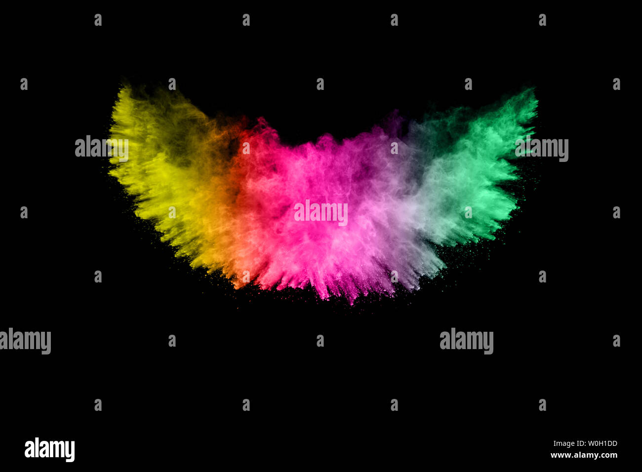Abstract multi color powder explosion on black background. Freeze ...