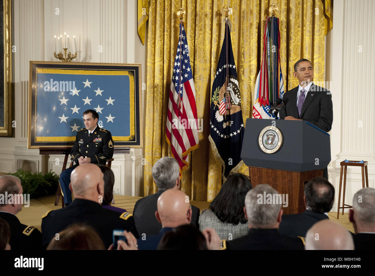 President Barack Obama applauds as he deliver remarks before awarding ...