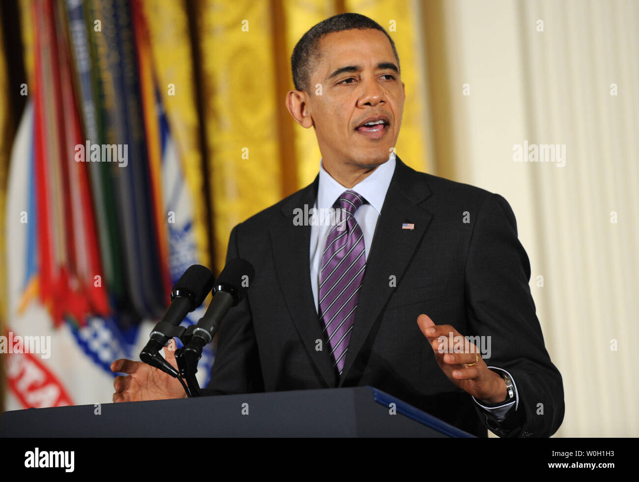 President Barack Obama applauds as he deliver remarks before awarding ...