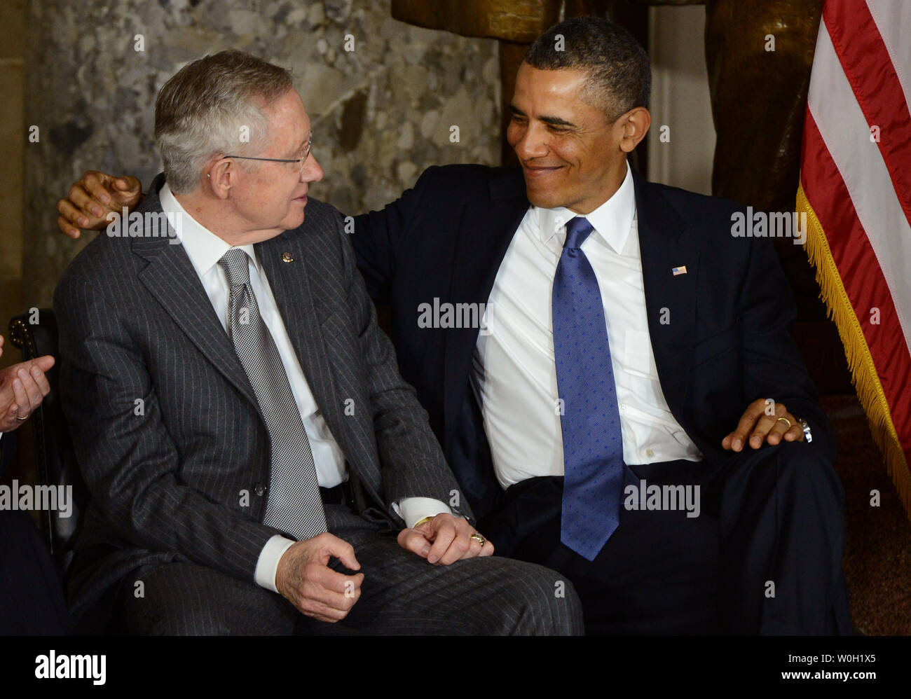 President Barack Obama embraces Senate Majority Leader Harry Reid (D-NV ...