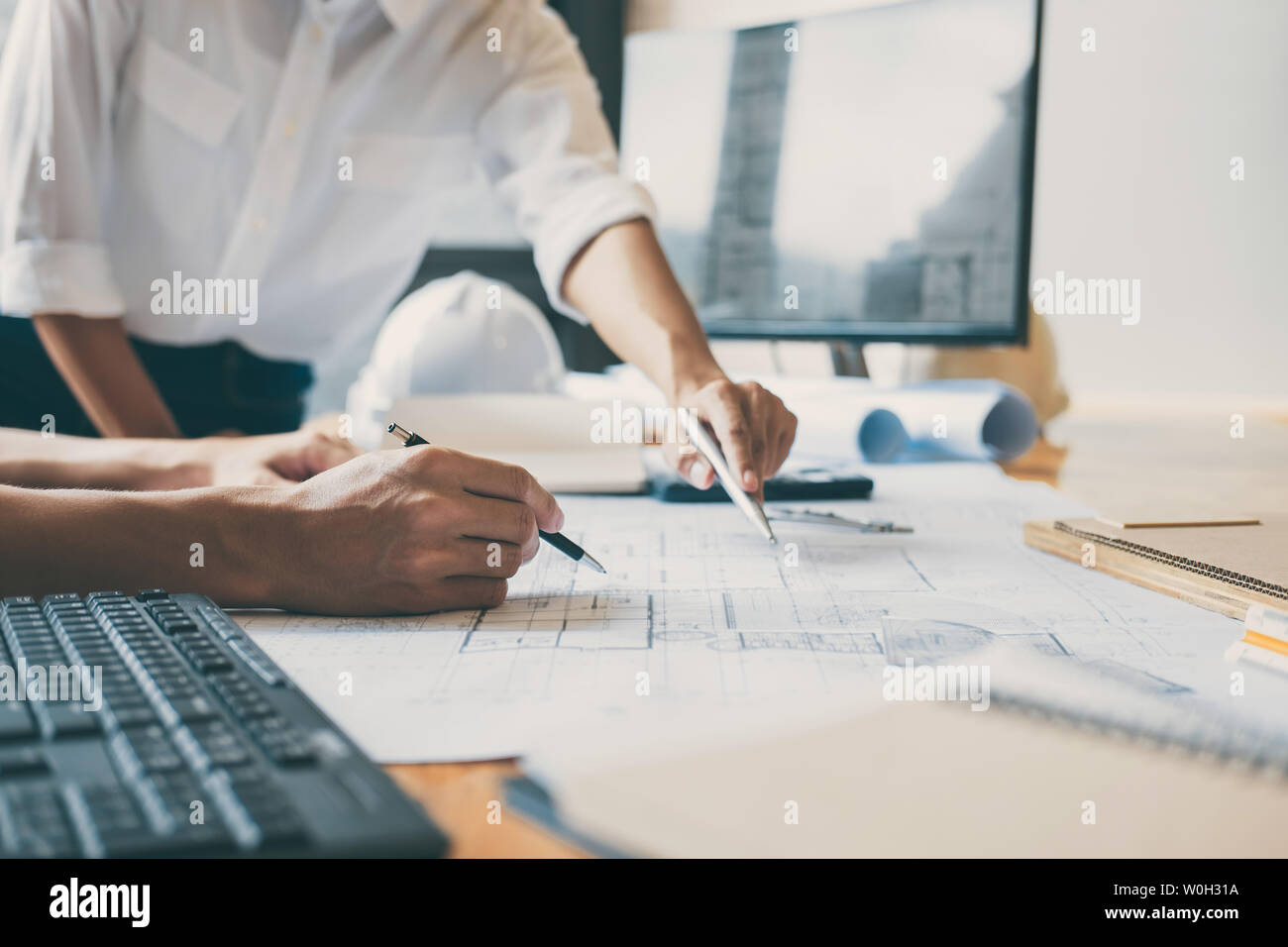 Team of Construction engineering or architect hands working on ...