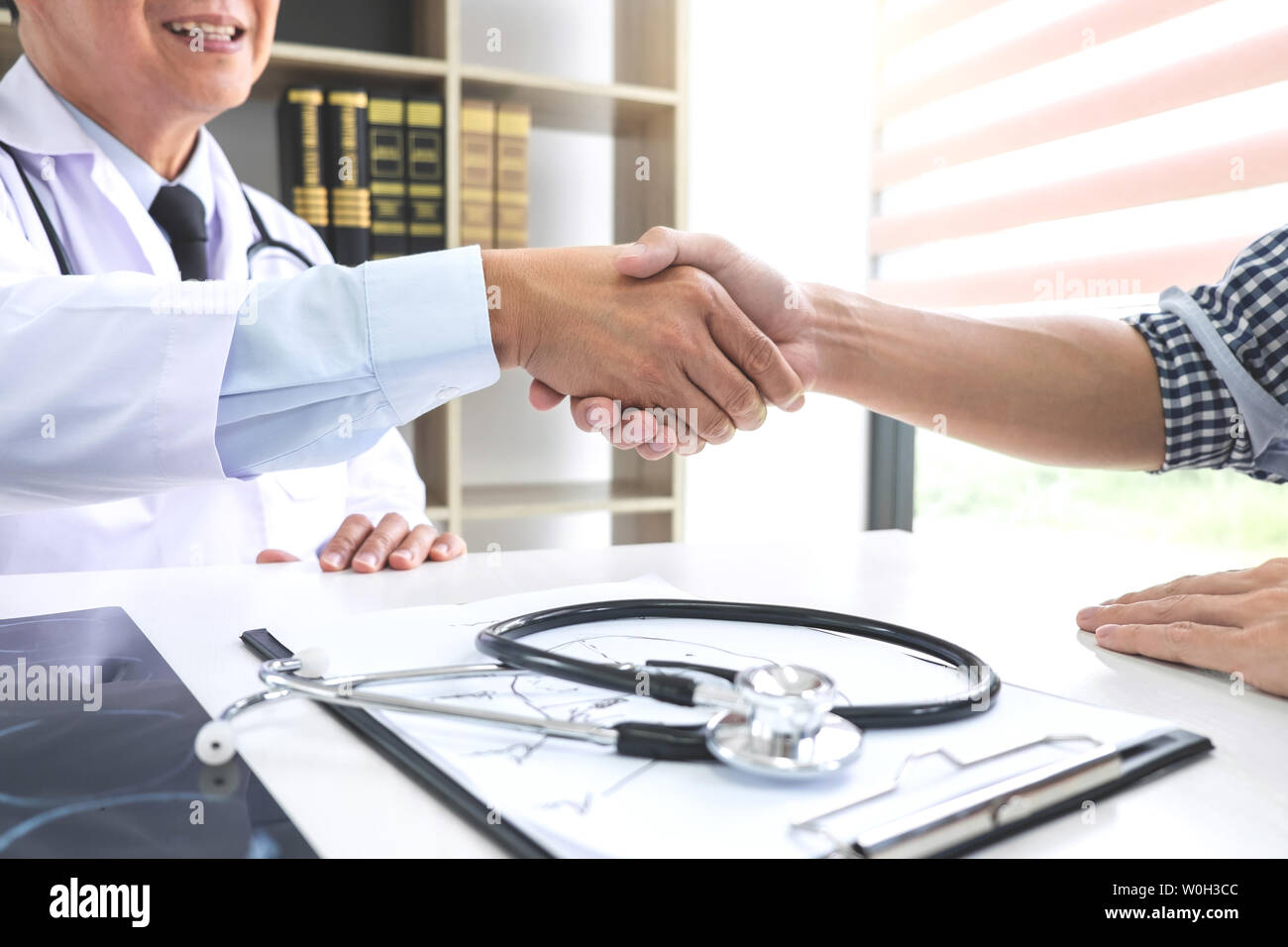 Professor Doctor having shaking hands with patient after recommend ...