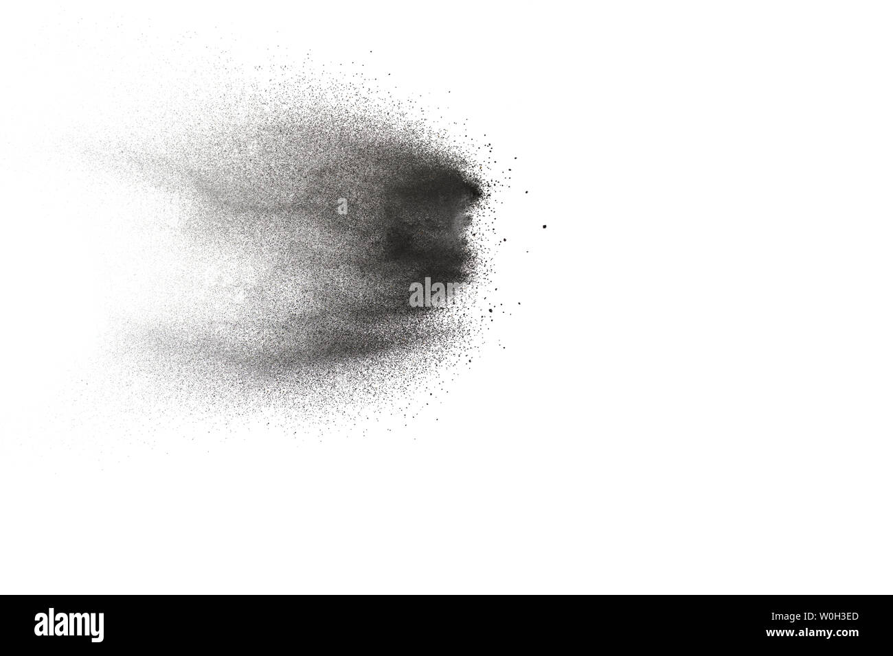 Black particles splattered on white background. Black powder dust ...