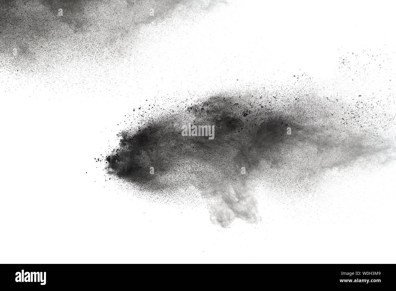 Black particles splattered on white background. Black powder dust ...