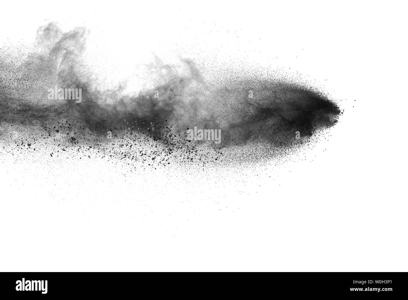 Black particles splattered on white background. Black powder dust ...