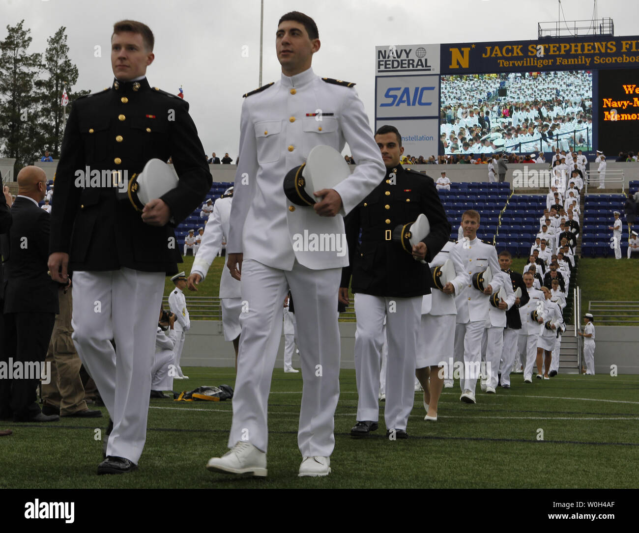 Midshipmen arrive for the the U.S. Naval Academy Graduation and ...