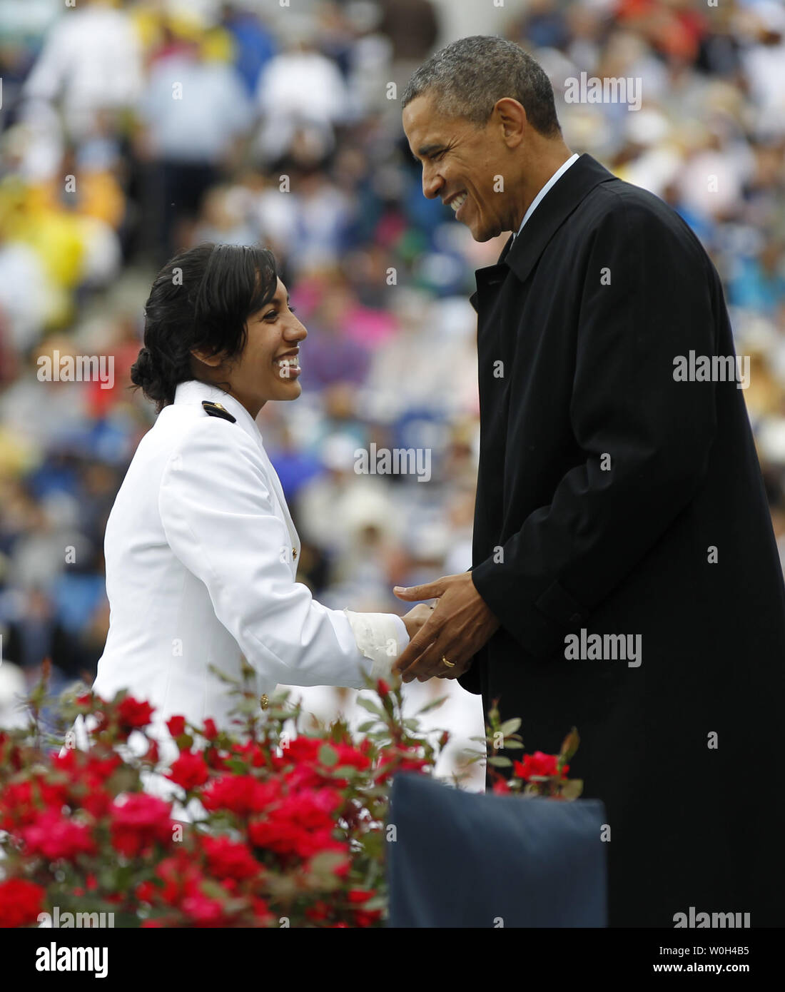 President Barack Obama congratulates a graduate during the U.S. Naval ...