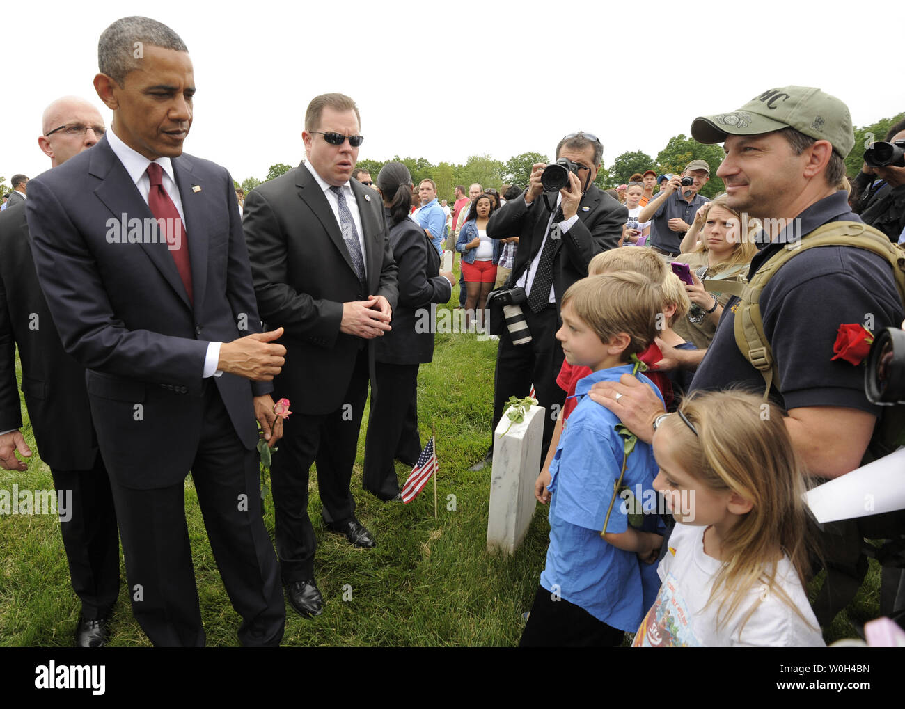US President Barack Obama gives a thumbs up while visiting with ...