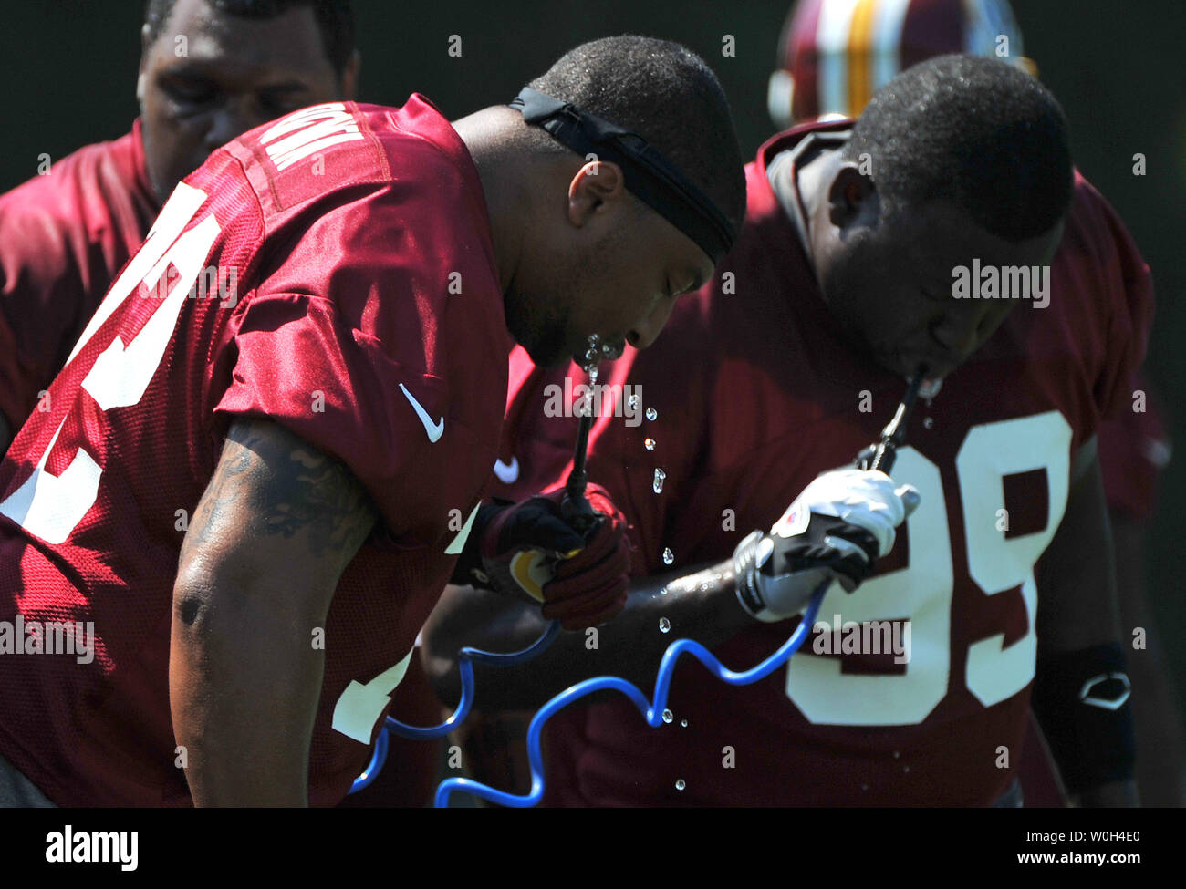 Washington Redskins Jarvis Jenkins (R) and Adam Gettis drink water ...