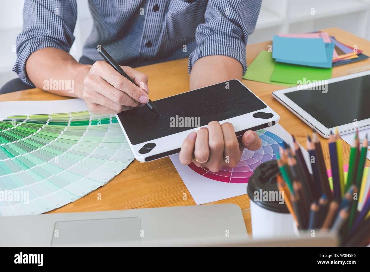 Young creative graphic designer working on project architectural ...