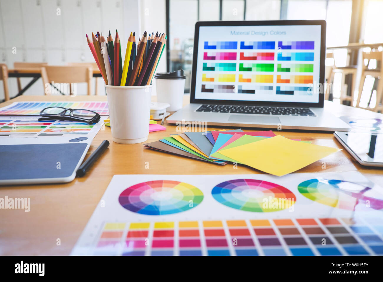 Graphic designer object tool and color swatch samples at workspace ...