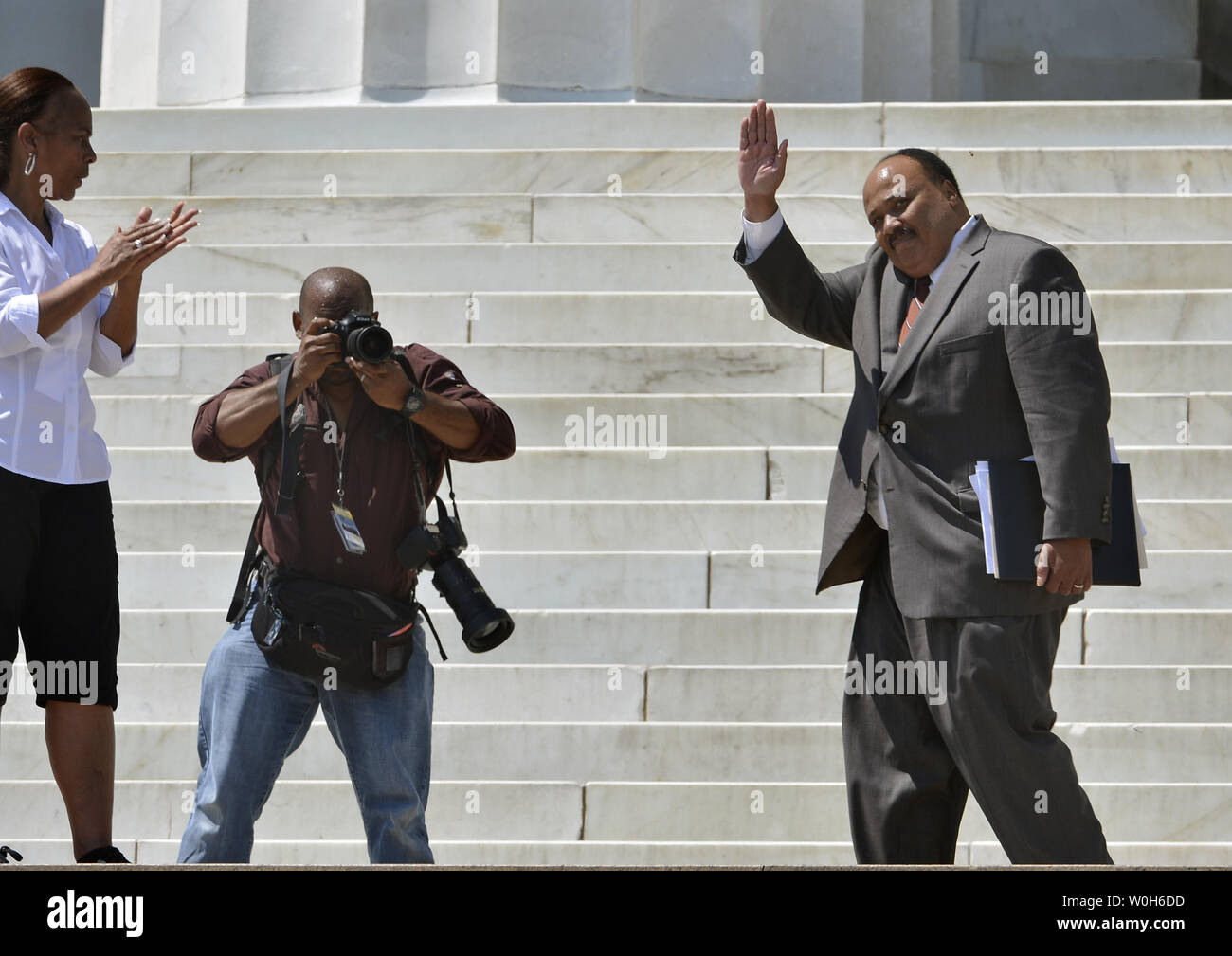 Martin Luther King III waves as he concludes remarks in front of the ...