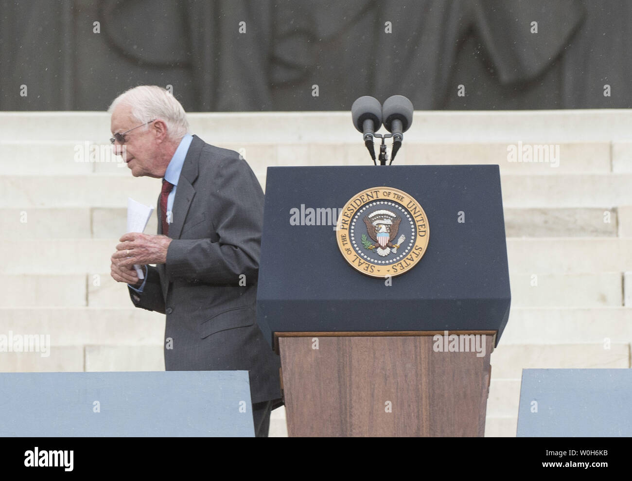Former President Jimmy Carter leaves the podium after delivering ...