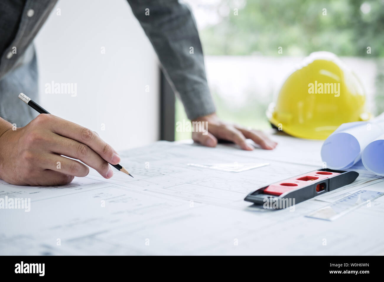 Construction engineering or architect hands working on blueprint ...