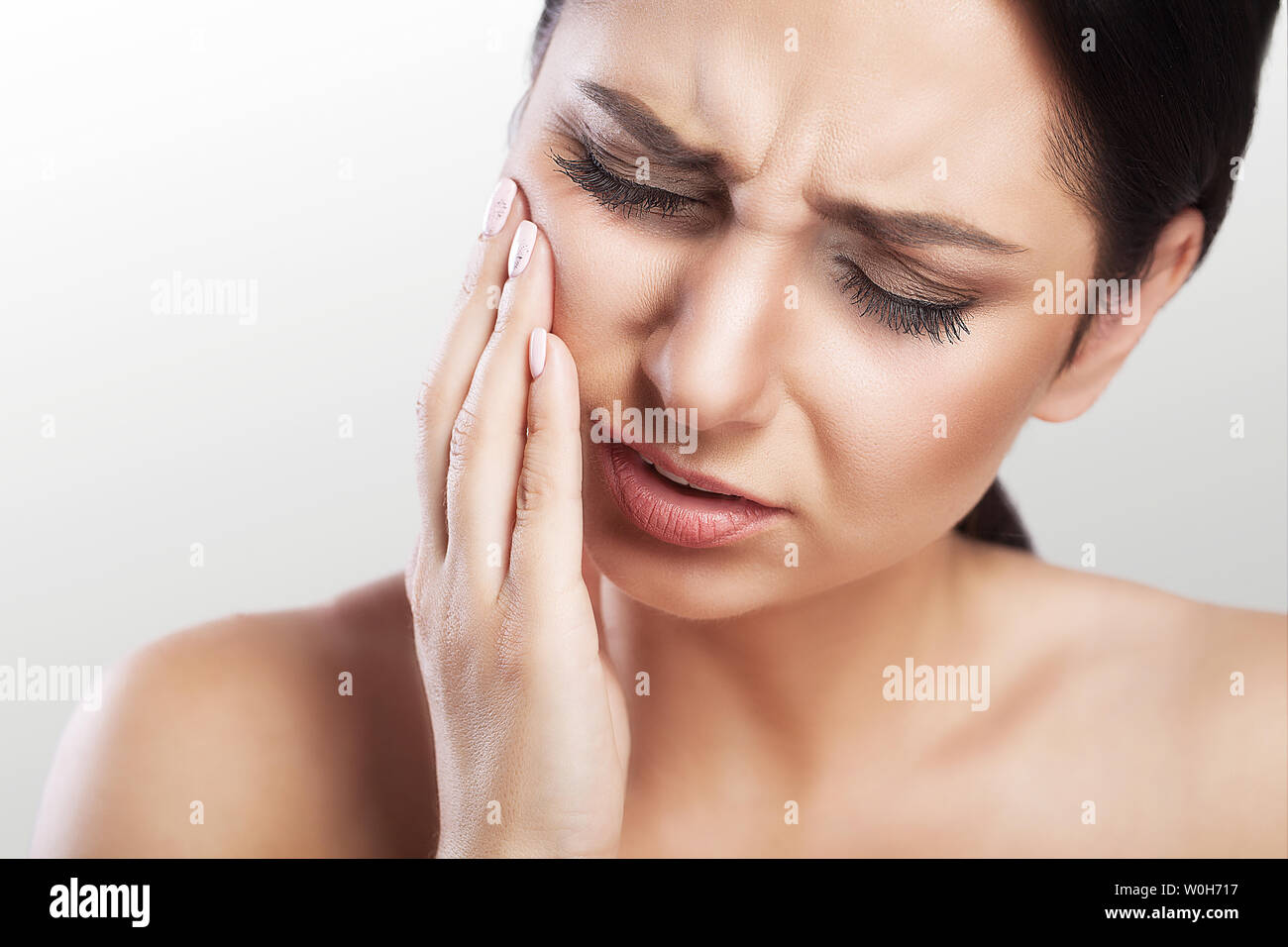 Teeth Problem. Woman Feeling Tooth Pain. Closeup Of A Beautiful Sad ...