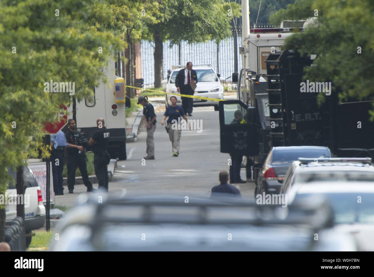 D.C. Metropolitan Police Officers work the crime scene at the Naval ...