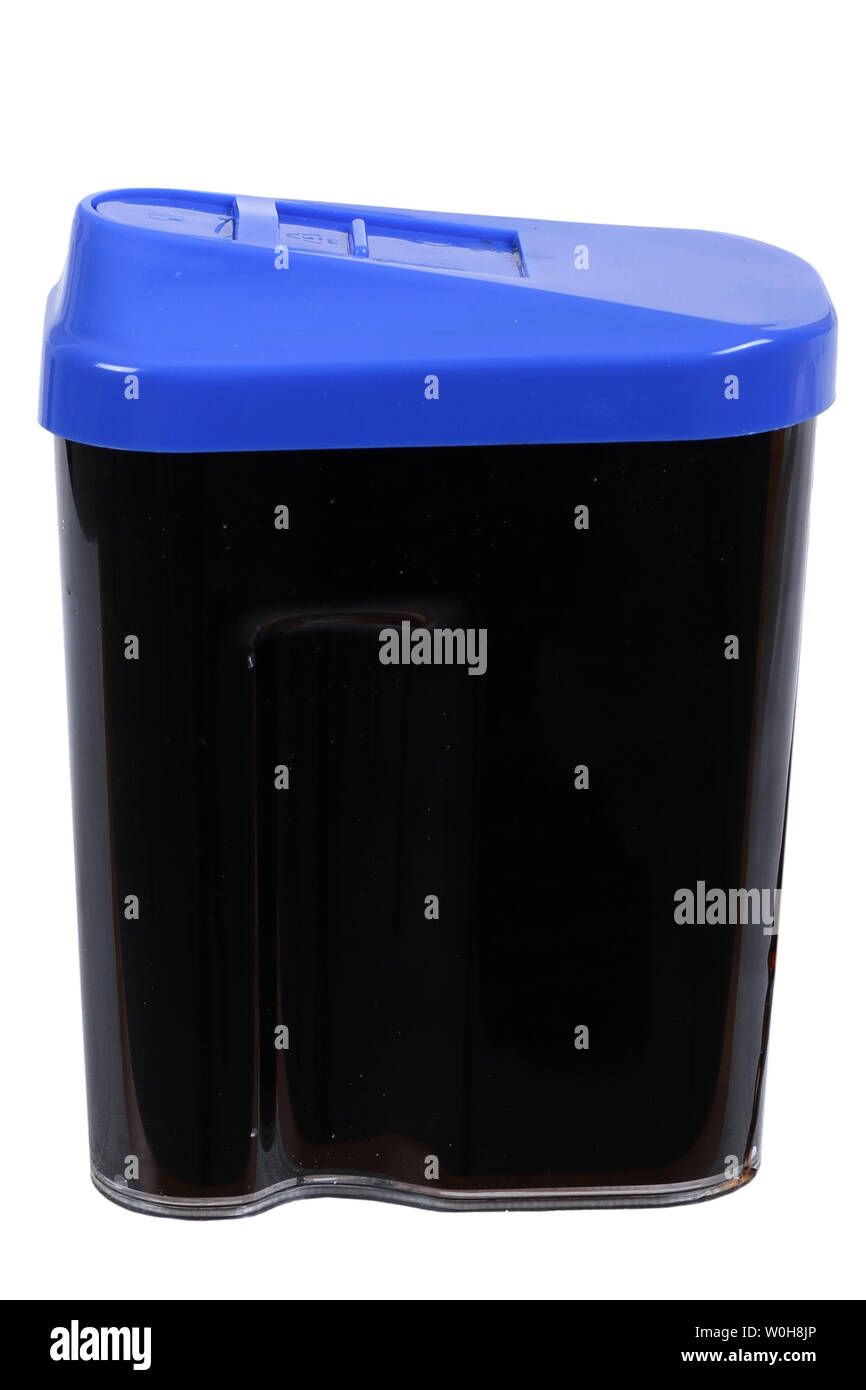 Pomegranate paste in plastic container Stock Photo - Alamy