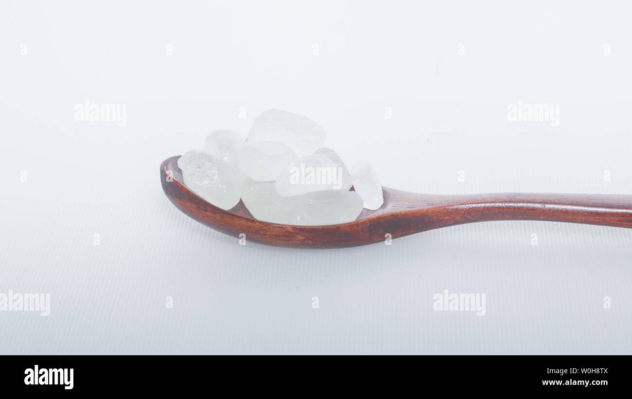 A spoonful of ice sugar placed on a white background Stock Photo - Alamy