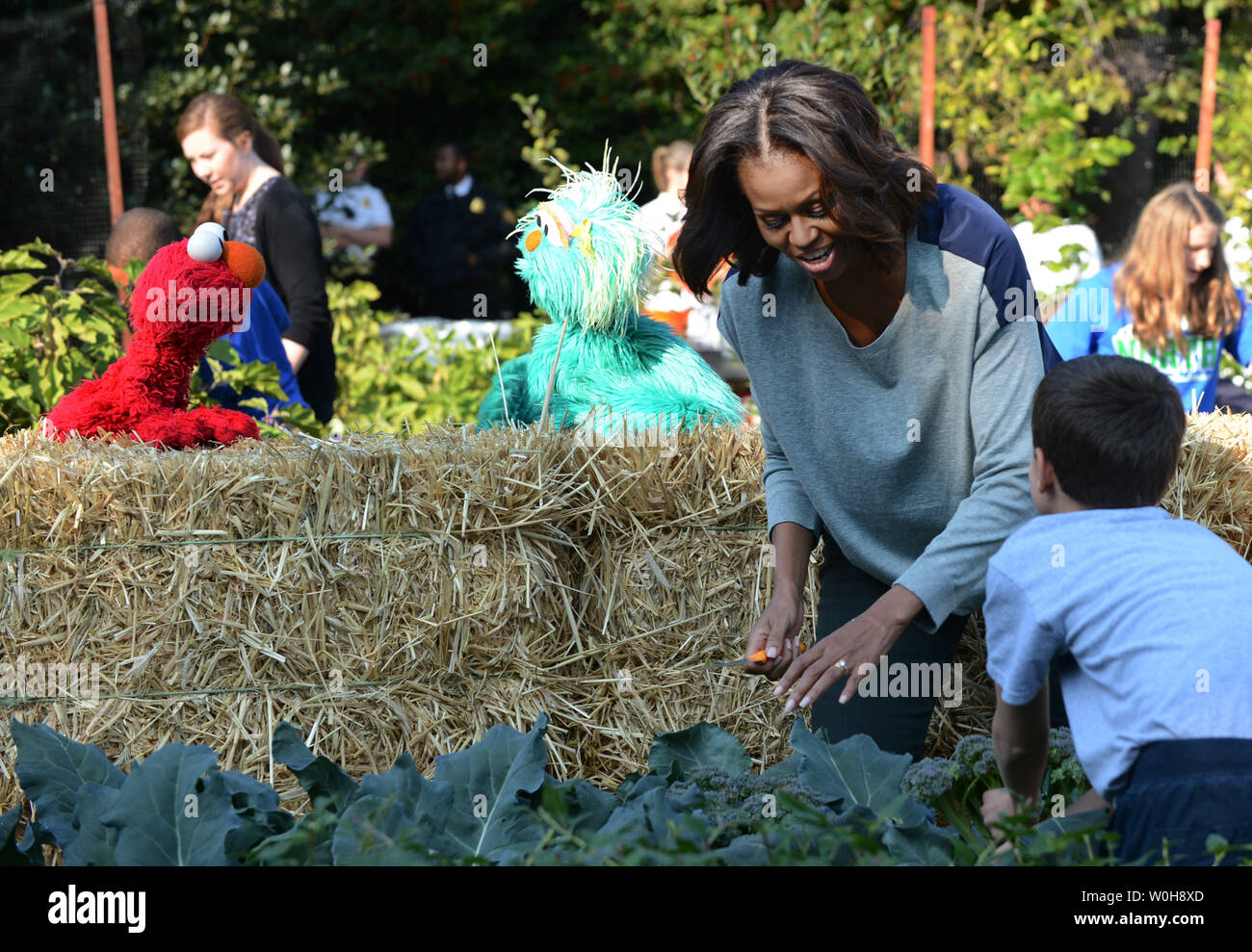With Sesame Street's Elmo and Rosita looking on, First Lady Michelle ...