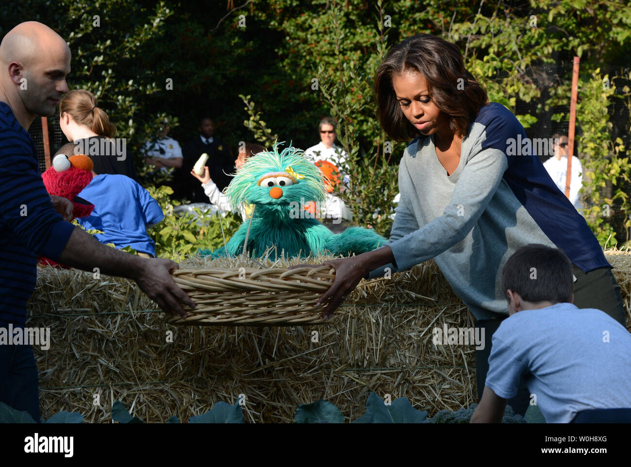With Sesame Street's Elmo and Rosita looking on, First Lady Michelle ...