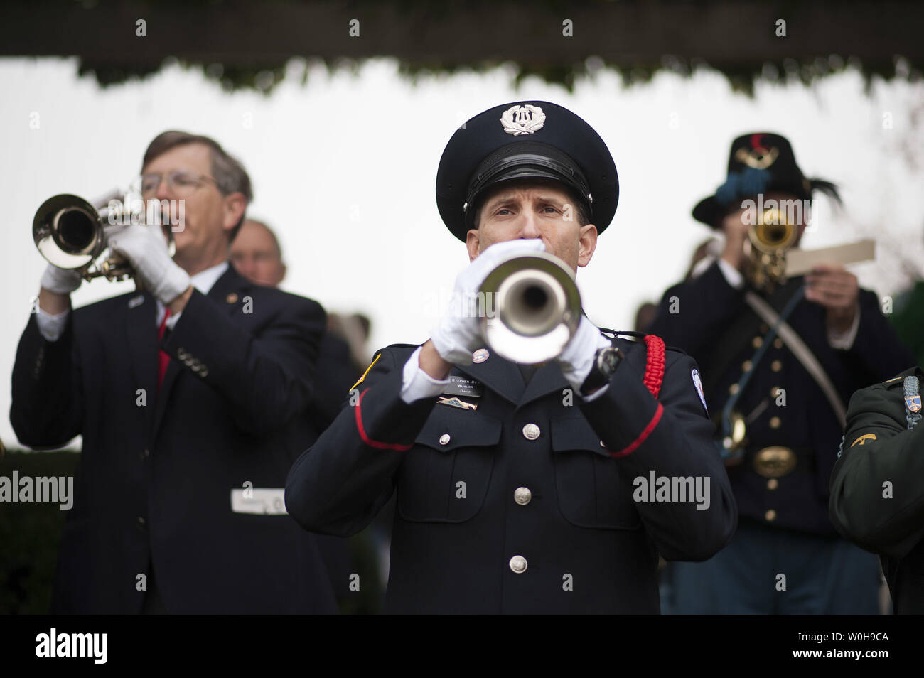 Stephen Bow plays Taps with fellow Buglers during the Bugle Call to ...
