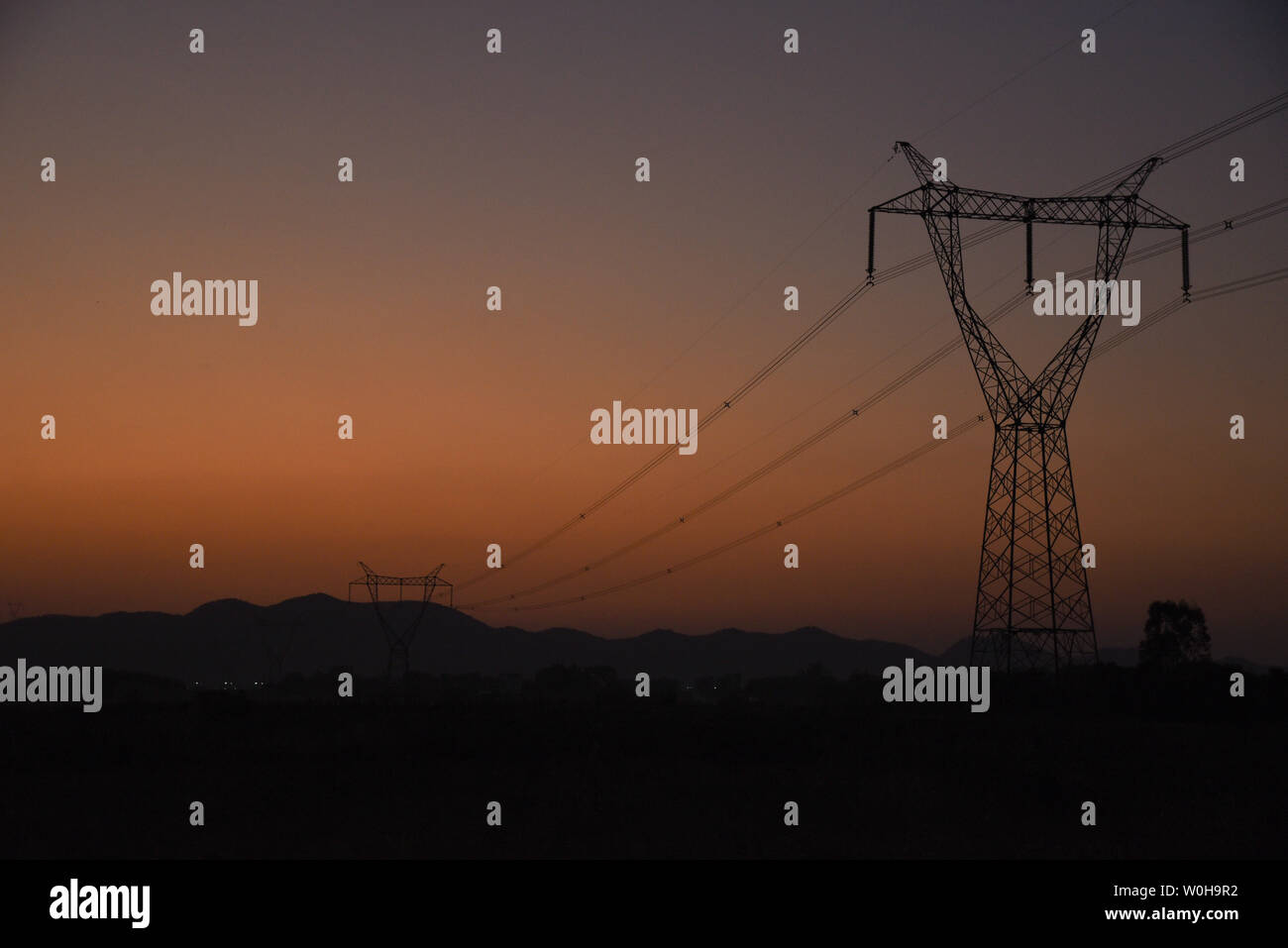 Telegraph pole at sunset Stock Photo - Alamy