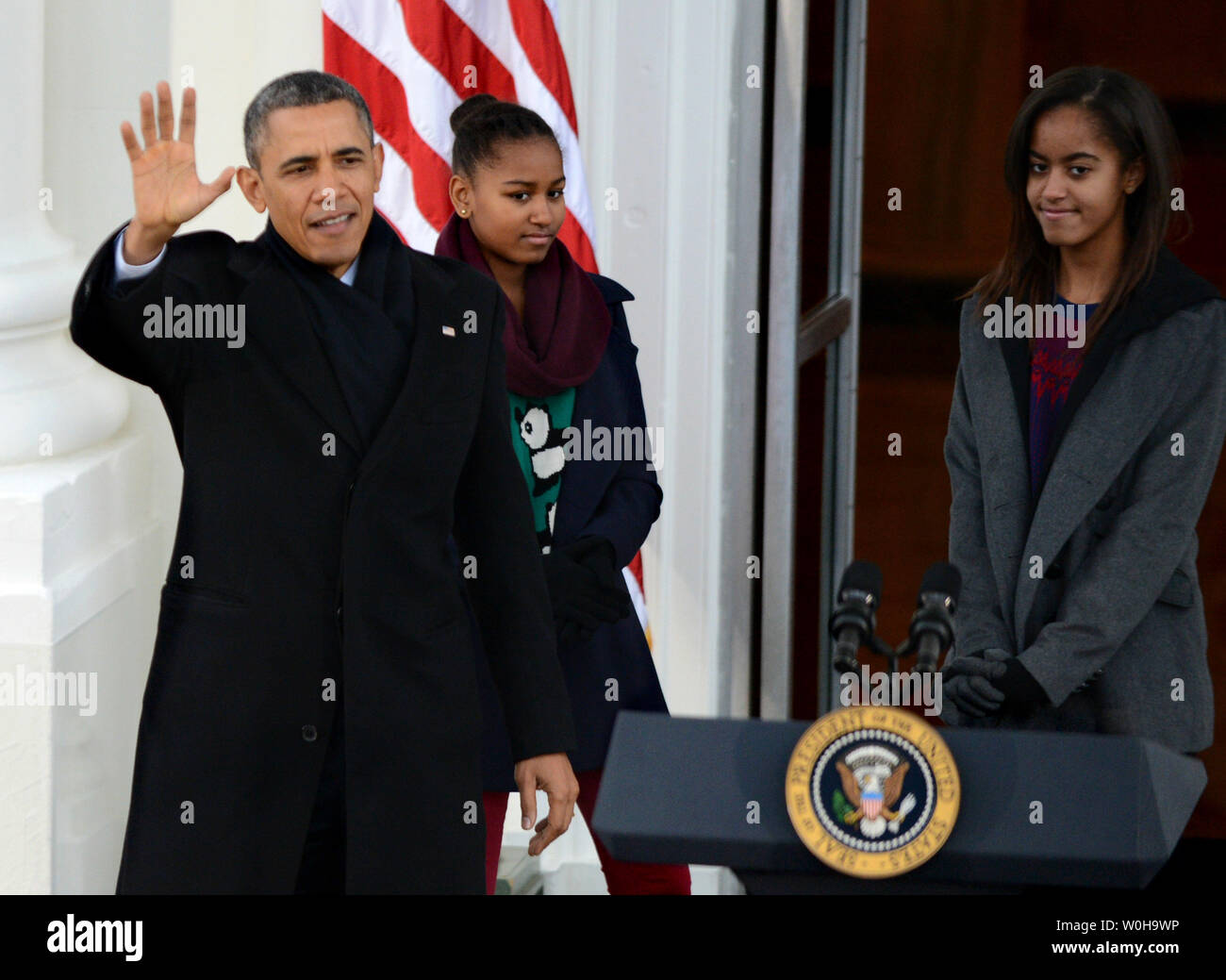 President Barack Obama waves goodbye after he pardoned "Popcorn", the ...