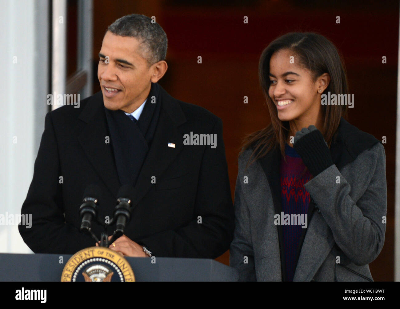 President Barack Obama with his daughter Malia makes a few comments ...