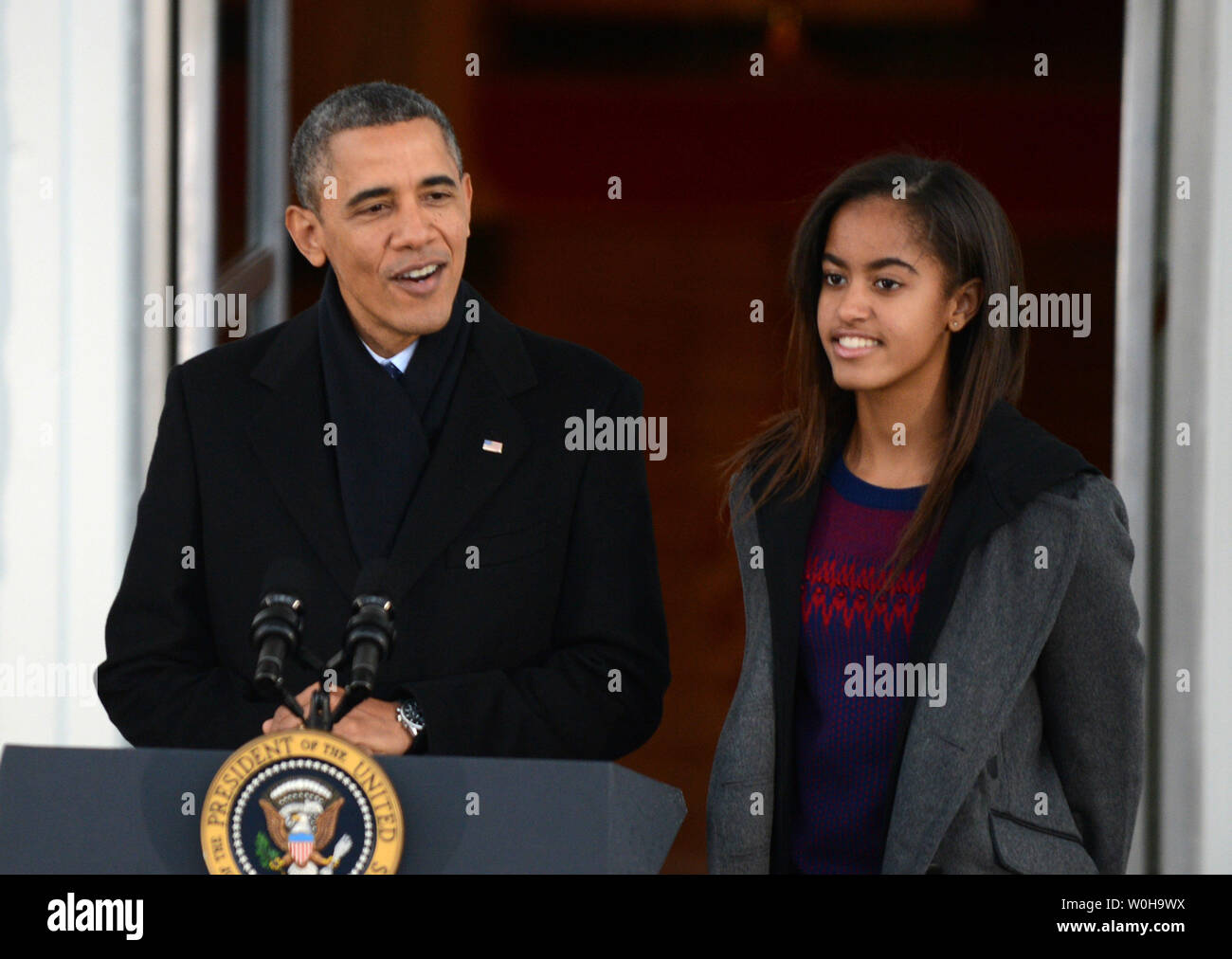 President Barack Obama with his daughter Malia makes a few comments ...