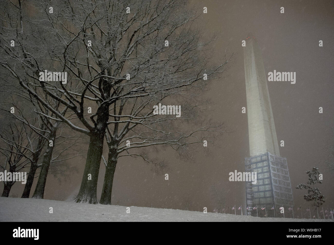 The Washington Monument is seen as snow falls in Washington, D.C. on ...