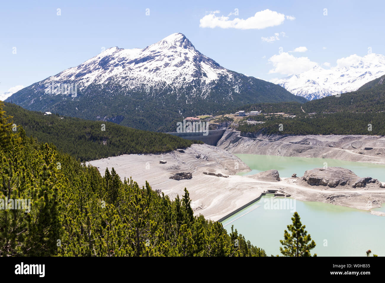 Alpine landscape with artificial lake, italy Stock Photo - Alamy