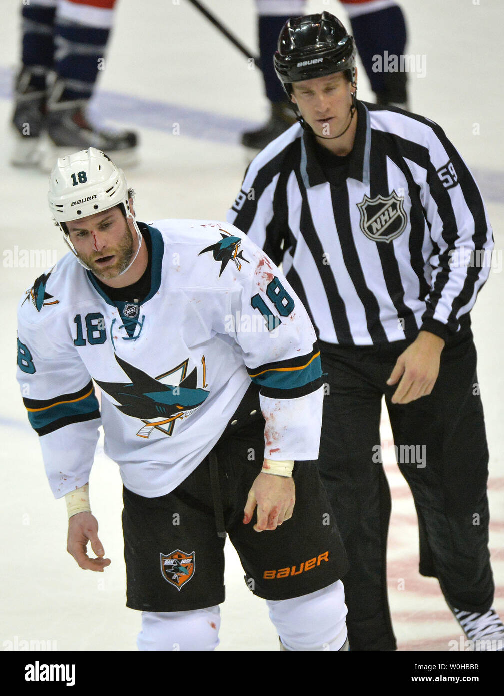 San Jose Sharks right wing Mike Brown is taken to the penally box for ...